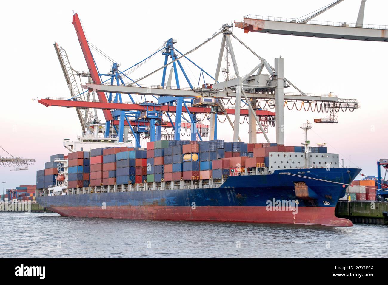 loading of a big container ship with cranes in port Stock Photo - Alamy