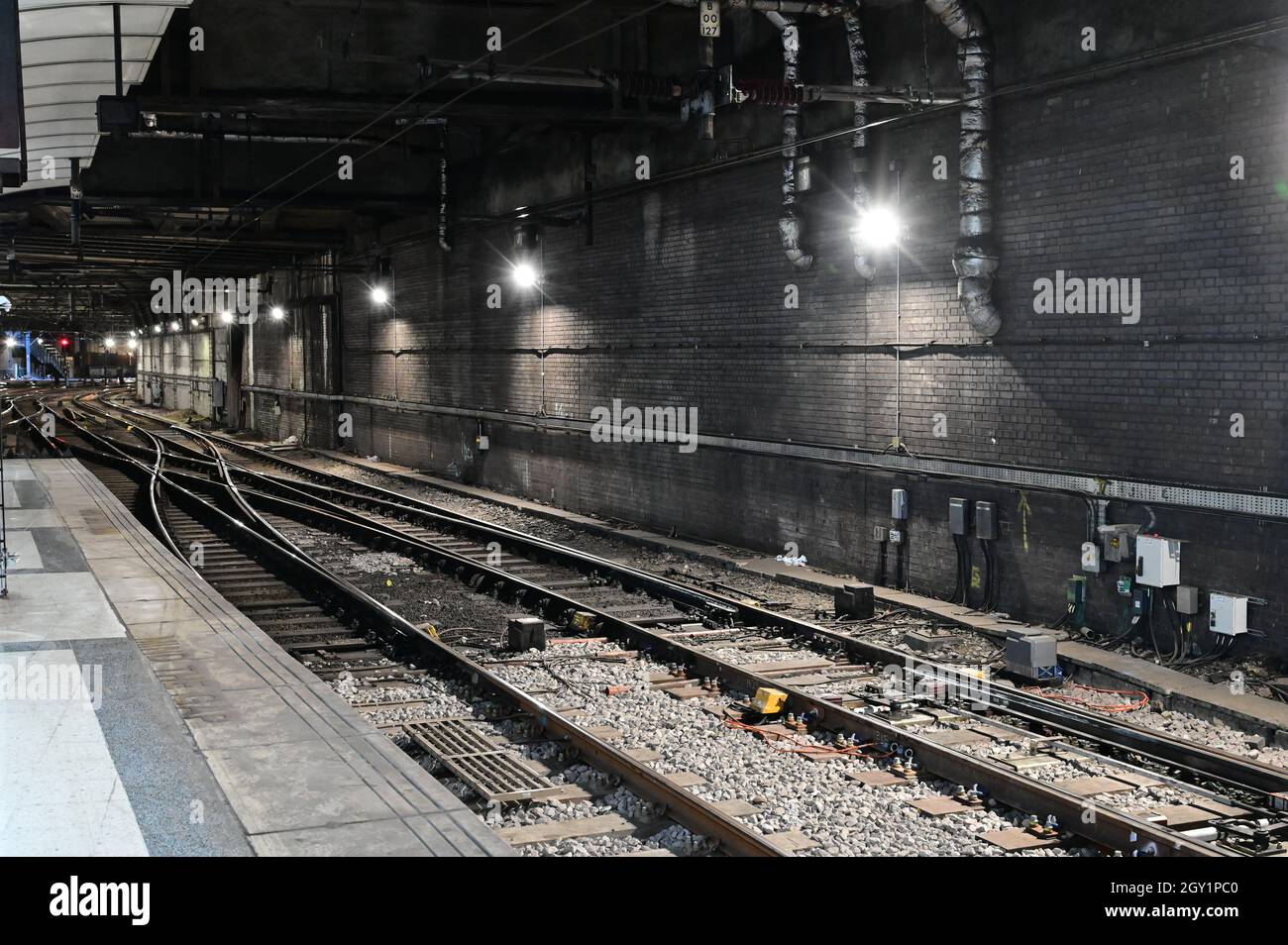 Underground tracks at a London railway station Stock Photo - Alamy