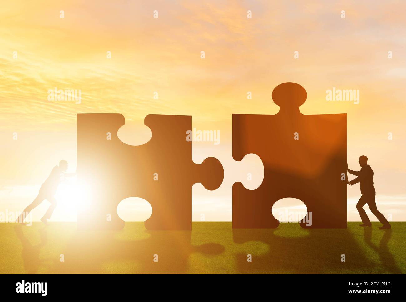 The business metaphor of teamwork with jigsaw puzzle Stock Photo - Alamy