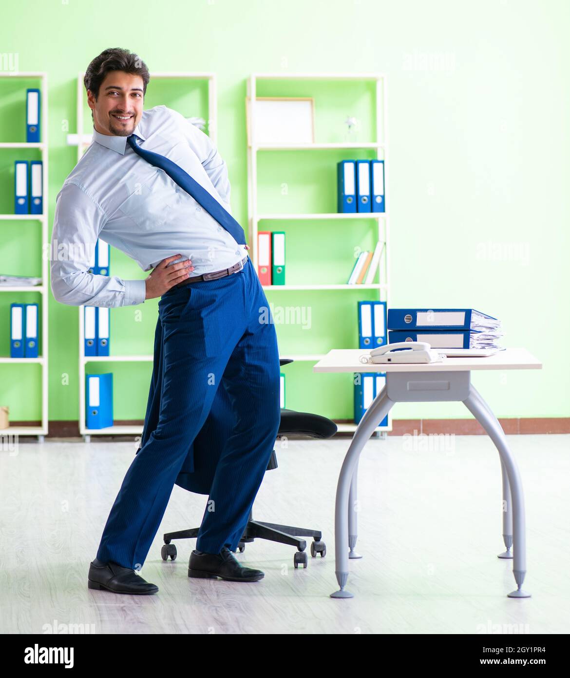 The employee doing exercises during break at work Stock Photo - Alamy