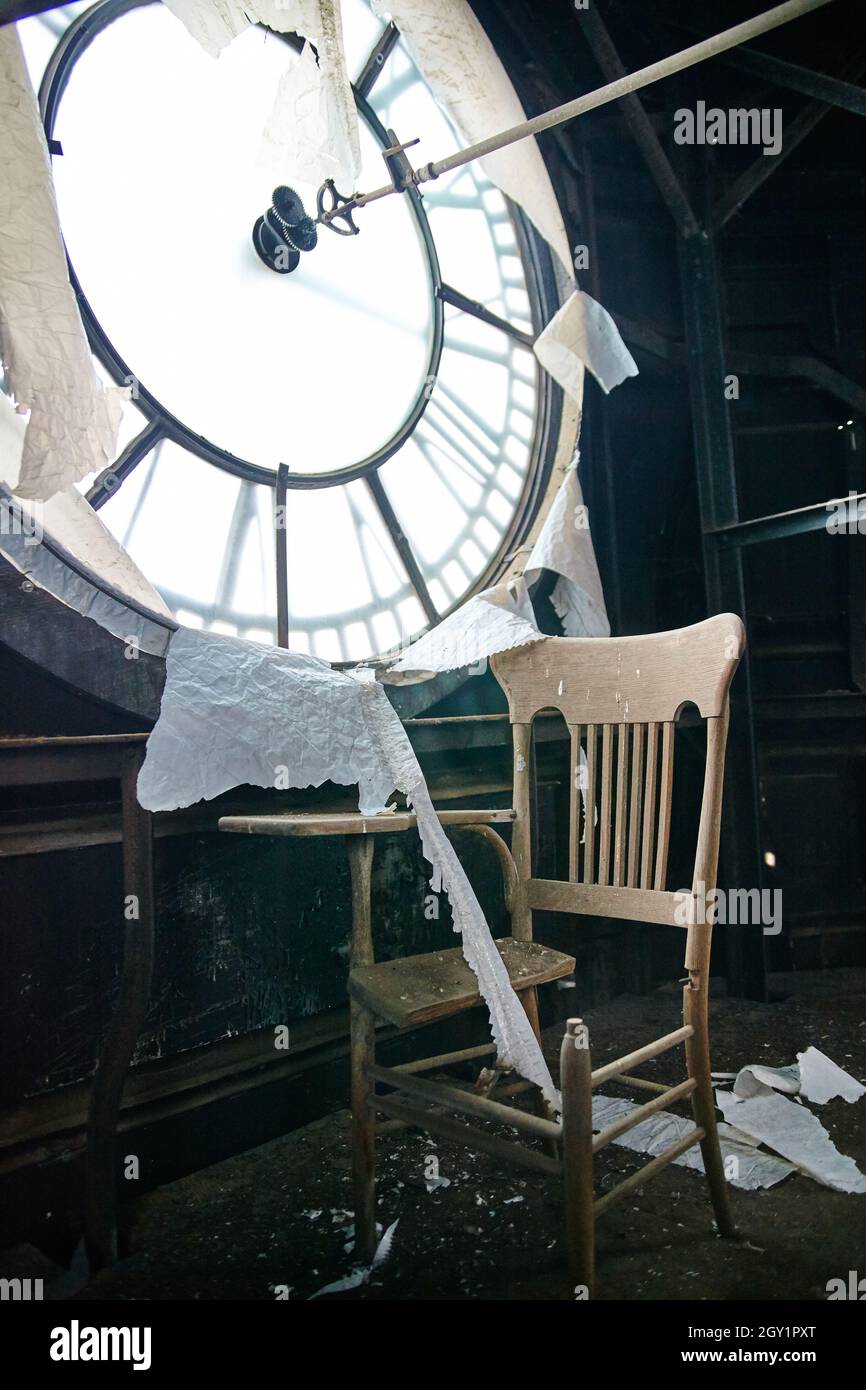 Antique schoolroom chair sitting inside an abandoned clock tower Stock Photo - Alamy