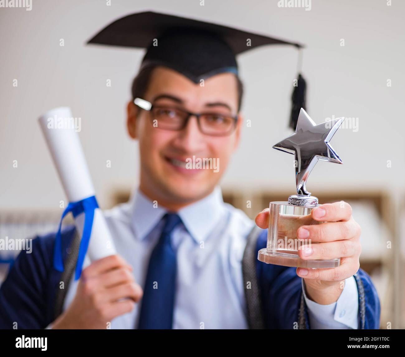 The young man graduating from university Stock Photo - Alamy