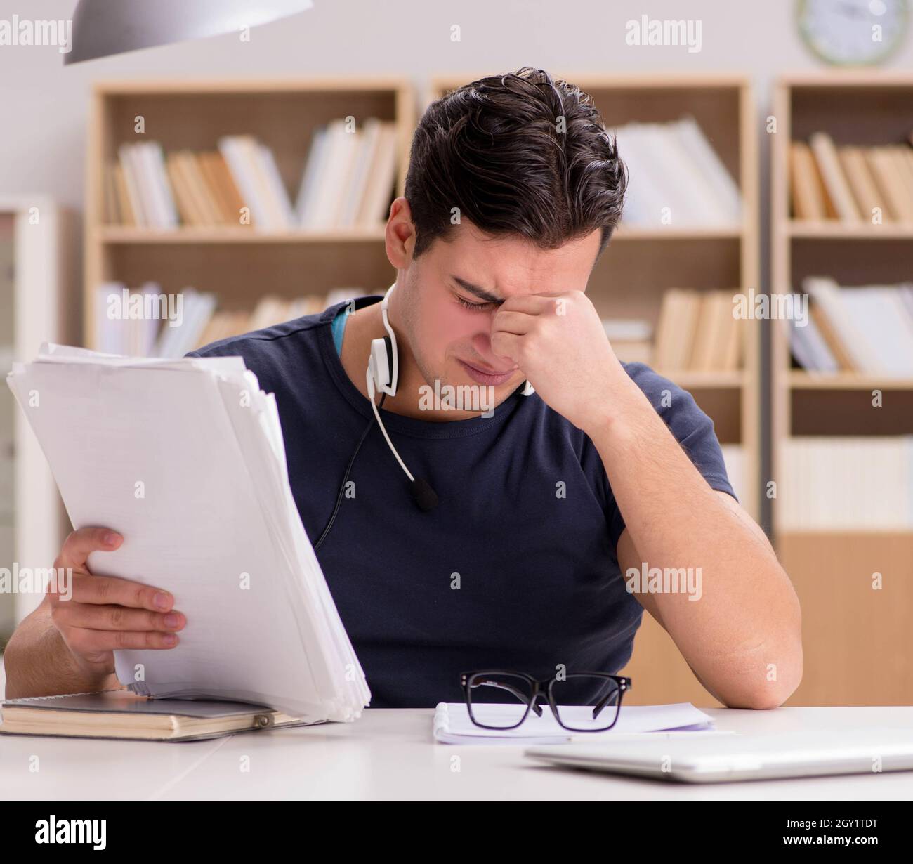 The unhappy student with too much to study Stock Photo - Alamy