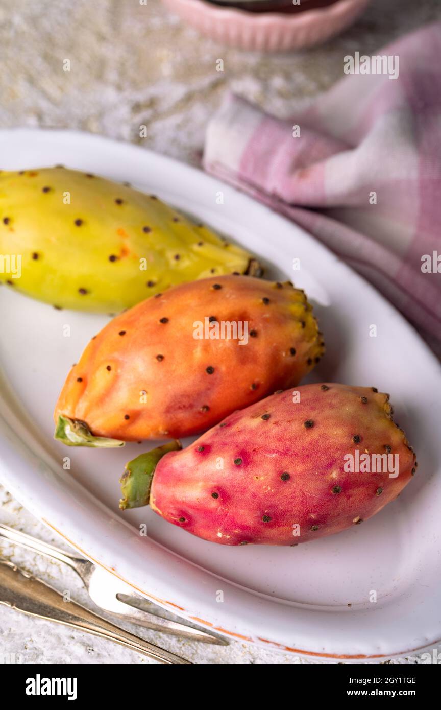 Vertical shot of fresh prickly pears in the white plate Stock Photo - Alamy