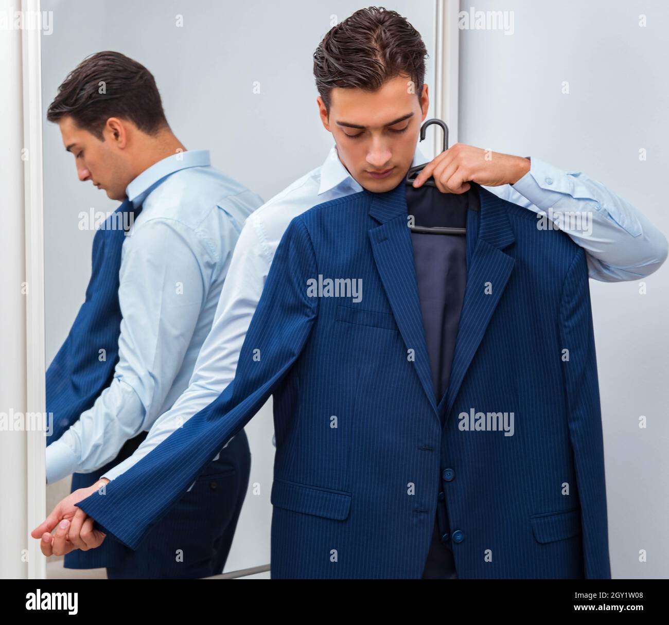 The businessman dressing up for work Stock Photo - Alamy