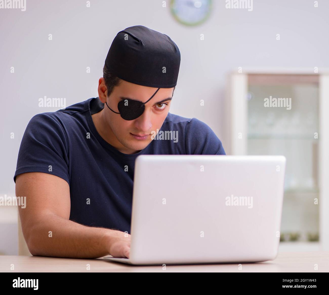 The digital security concept with pirate at computer Stock Photo - Alamy