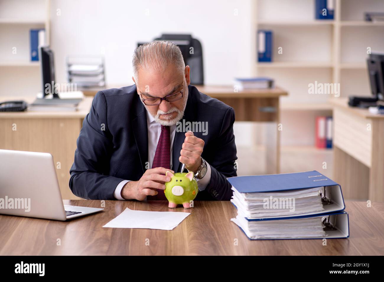 Old employee in retirement concept Stock Photo - Alamy