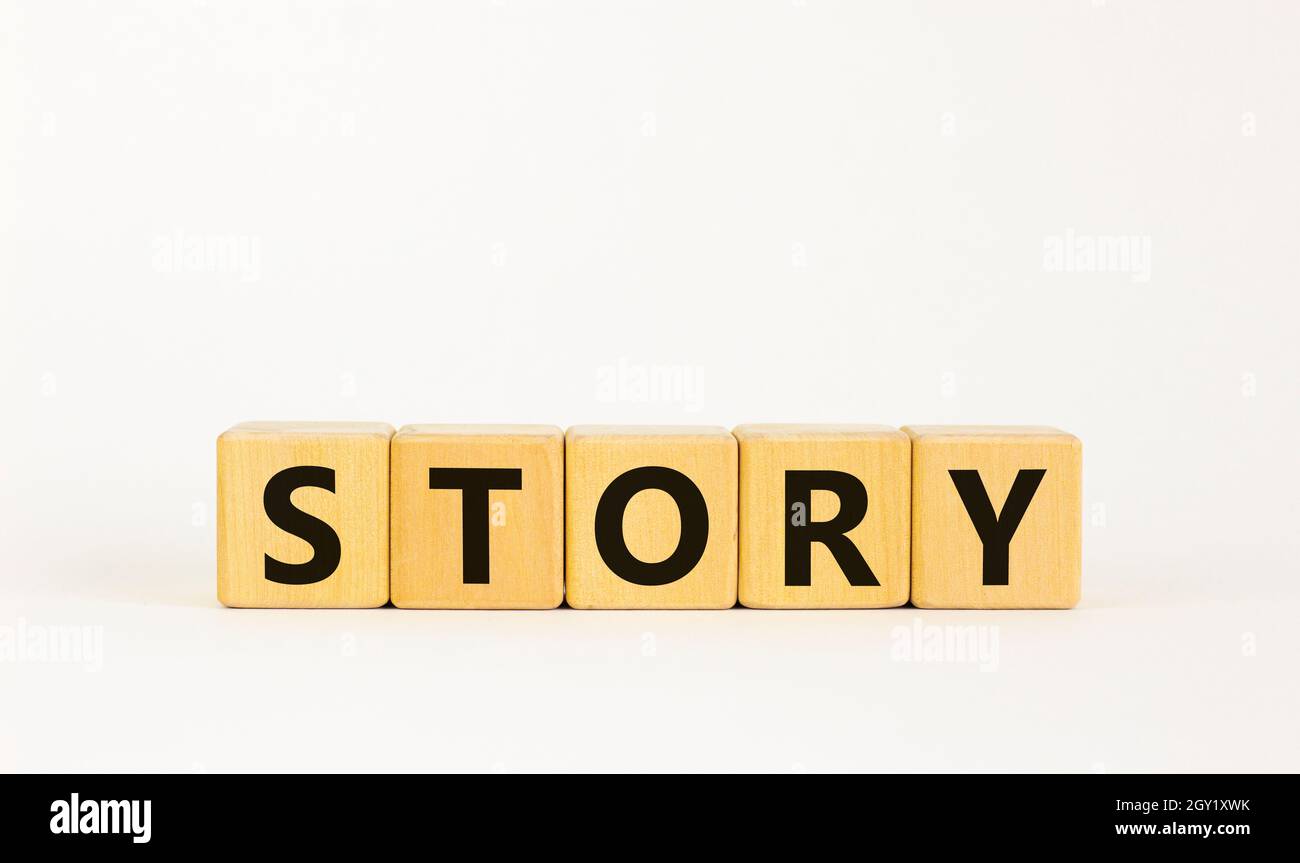 Story and storytelling symbol. The concept word 'story' on wooden cubes ...
