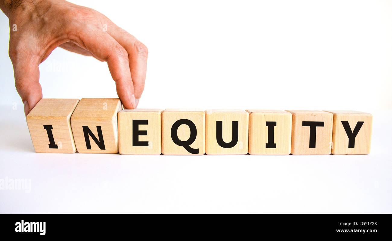 Inequity or equity symbol. Businessman turns wooden cubes and changes ...