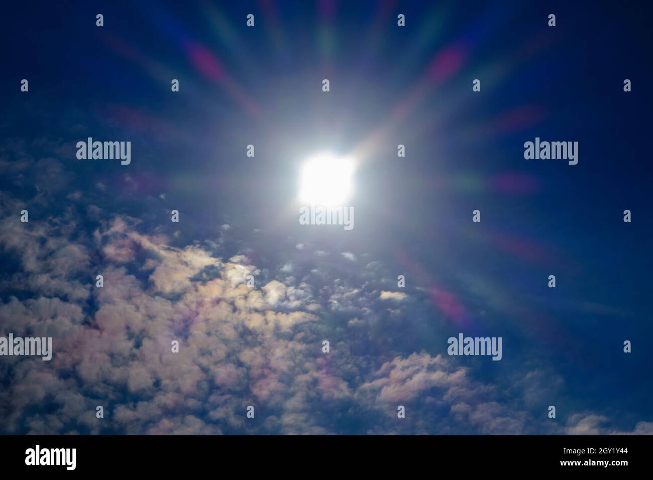 Refraction of sun light, colorful cloudy landscape Stock Photo - Alamy
