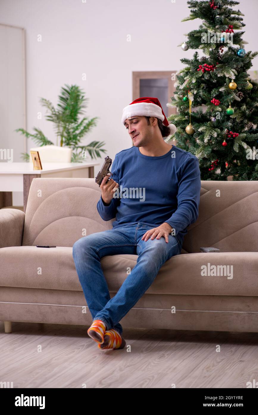 Young man celebrating new year alone at home Stock Photo - Alamy