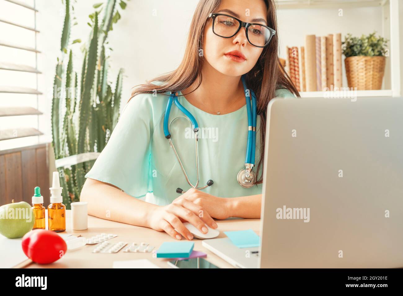 Female medicine doctor filling patient medical form or prescription ...