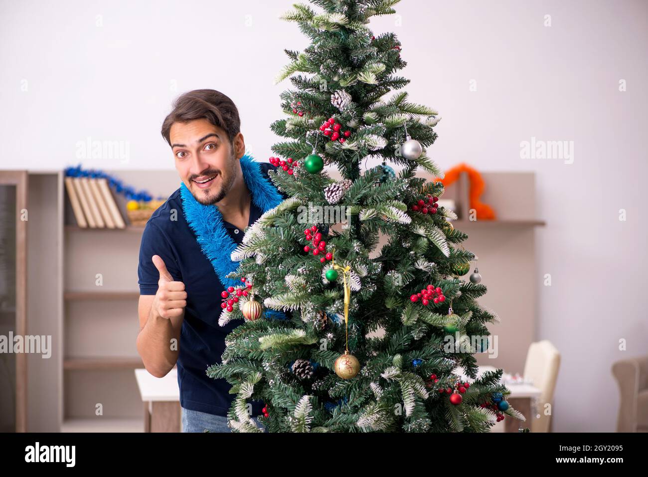 Young man celebrating New year at home alone Stock Photo - Alamy
