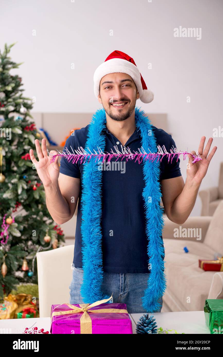 Young man celebrating New year at home alone Stock Photo - Alamy