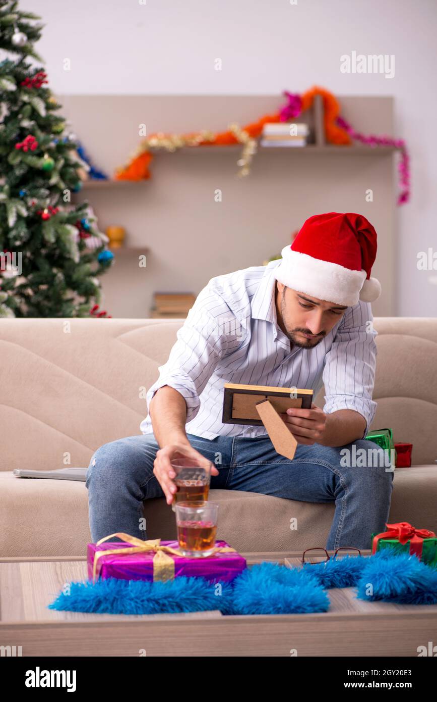 Young man celebrating New year at home alone Stock Photo - Alamy