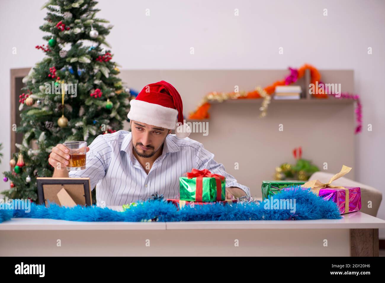 Young man celebrating New year at home alone Stock Photo - Alamy