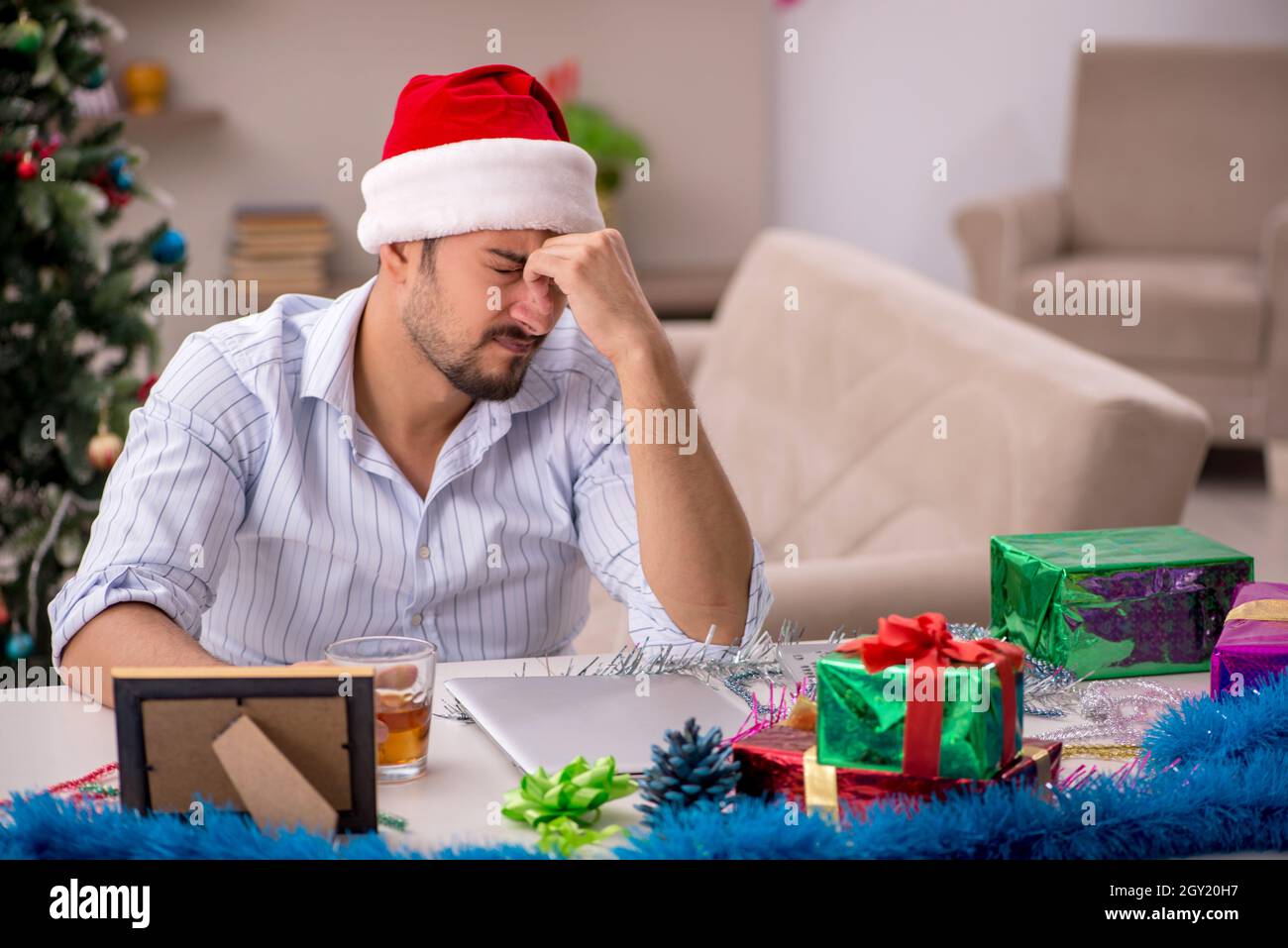 Young man celebrating New year at home alone Stock Photo - Alamy