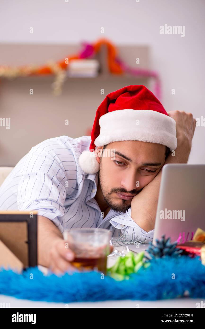 Young man celebrating New year at home alone Stock Photo - Alamy