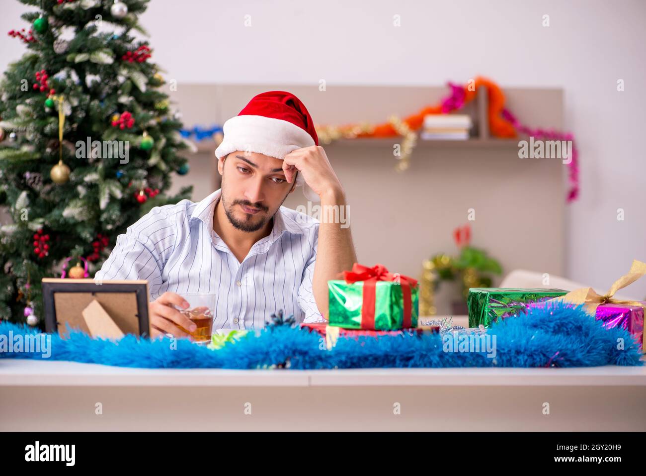 Young man celebrating New year at home alone Stock Photo - Alamy
