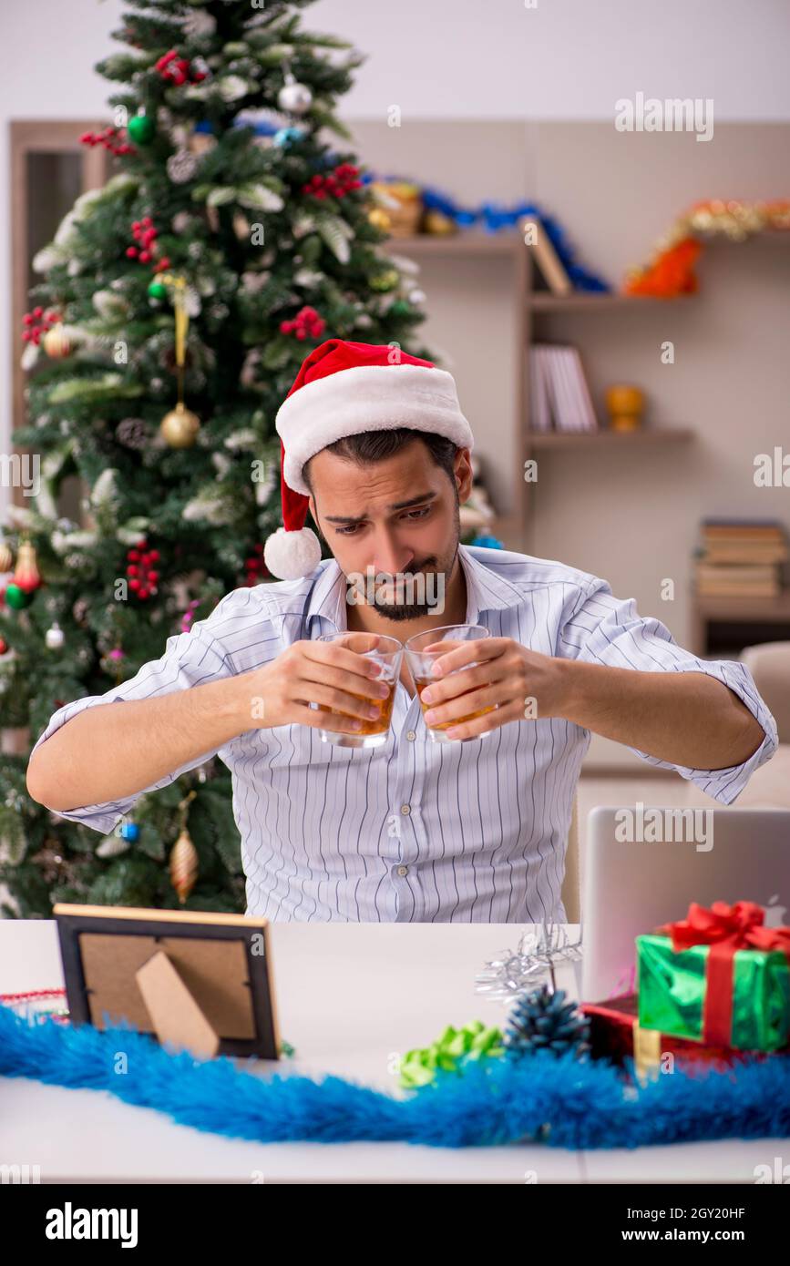Young man celebrating New year at home alone Stock Photo - Alamy