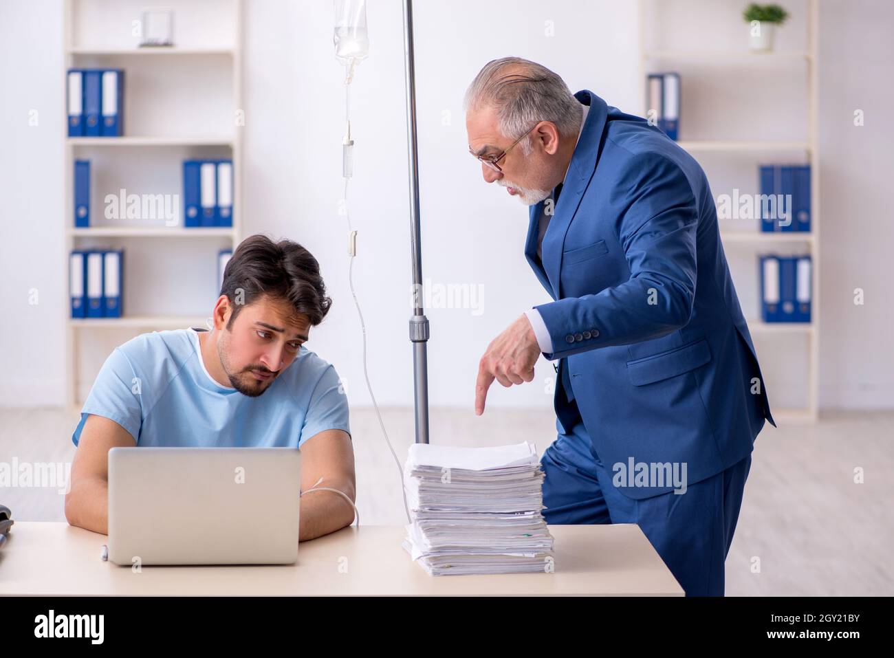 Young employee feeling bad at workplace Stock Photo - Alamy