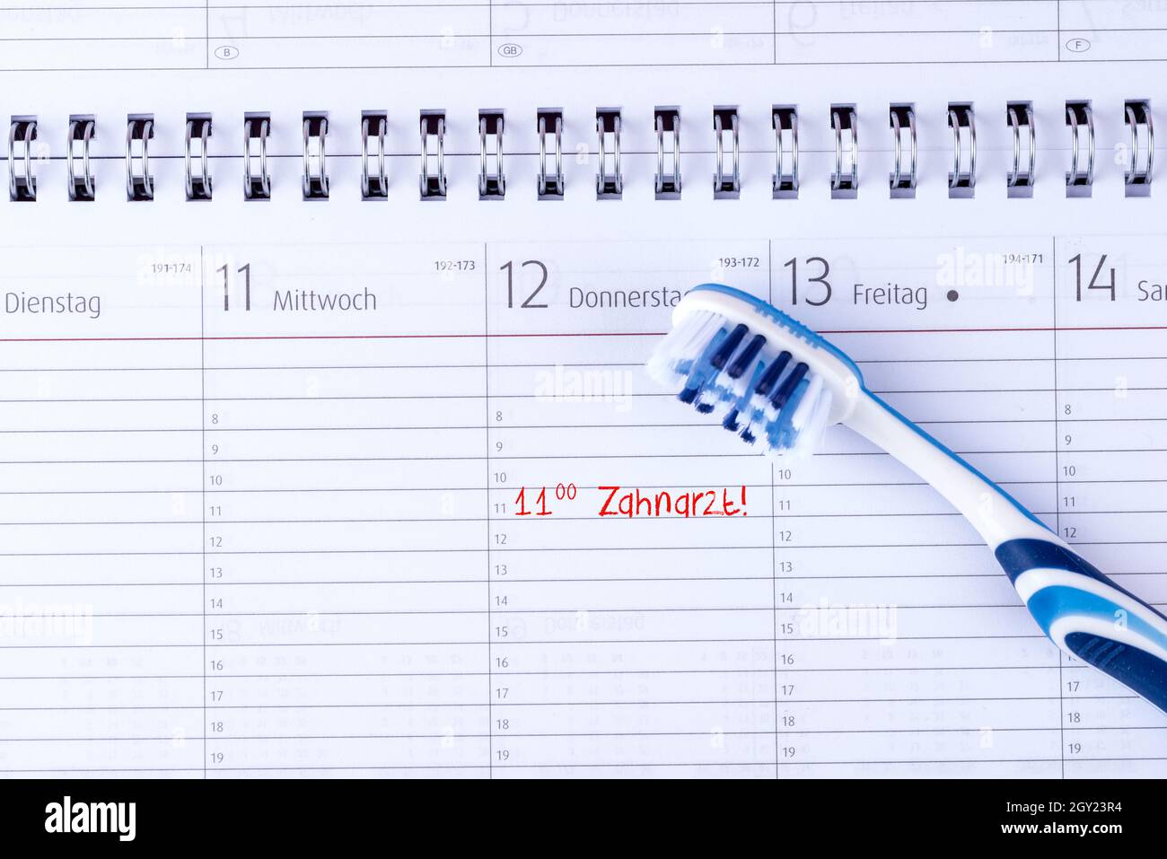 Top view shot of a calendar and toothbrush on it Stock Photo - Alamy