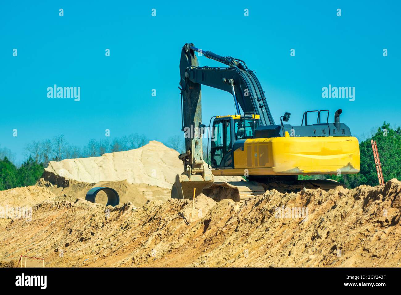 Crawler excavator front view digging on demolition site Stock Photo - Alamy