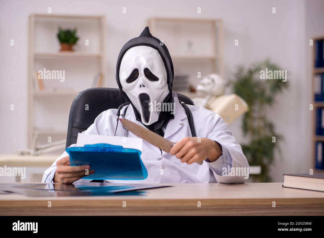 Devil doctor working at the hospital Stock Photo - Alamy