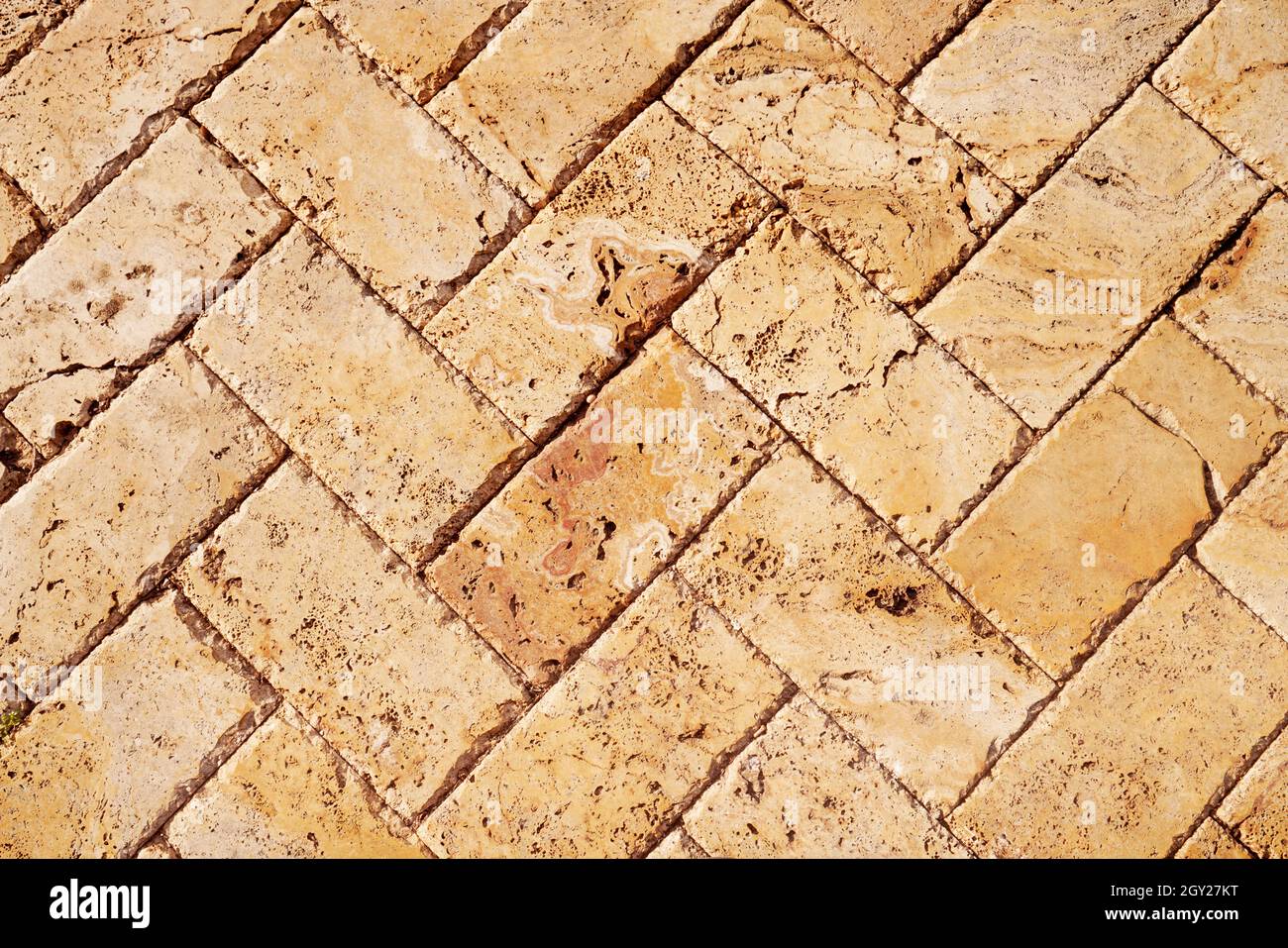 Yellow brown stone pavers background. Neutral texture of a flat brick ...