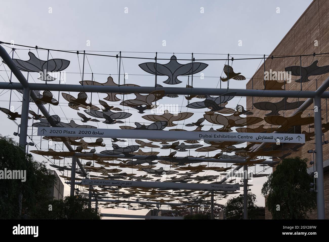 Dove inspired covered walkway with directions to the 2020 Plaza and ...