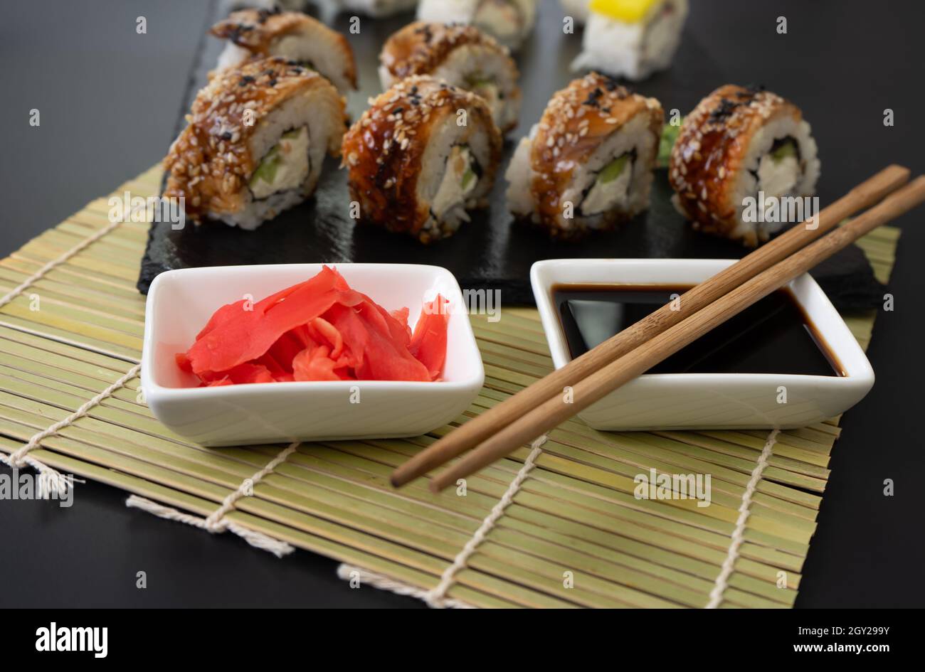 Sushi selection on black slate, black food border background Stock ...