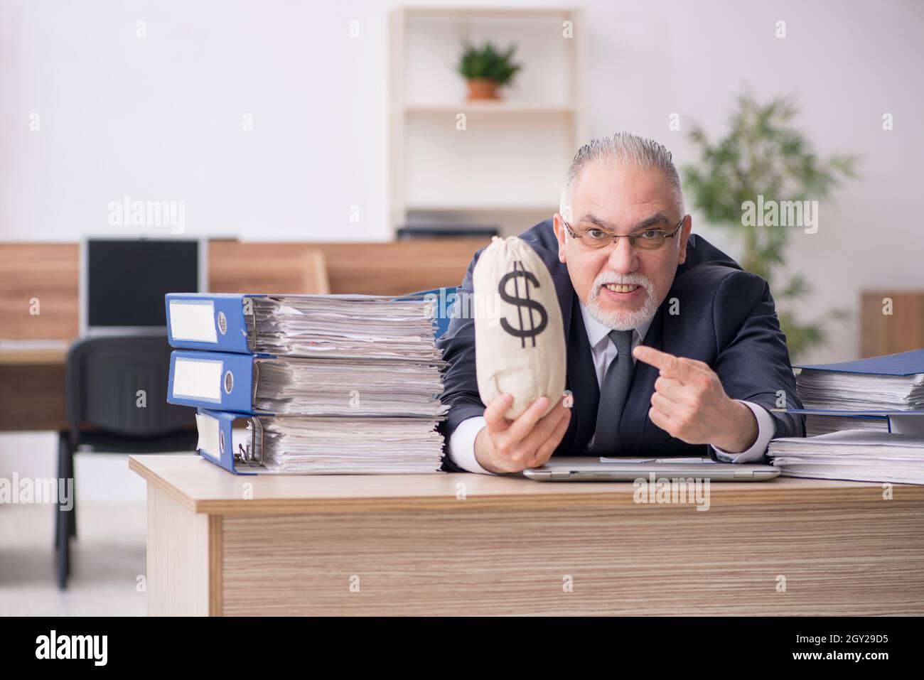 Aged businessman employee in remuneration concept Stock Photo - Alamy
