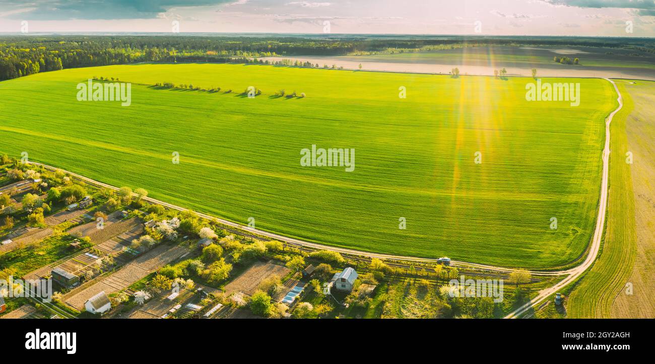 Countryside Rural Landscape With Small Village, Gardens And Green Field ...