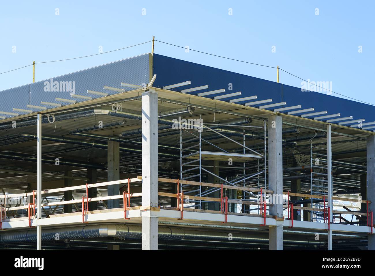 unfinished metal frame of a new modern industrial building with ...