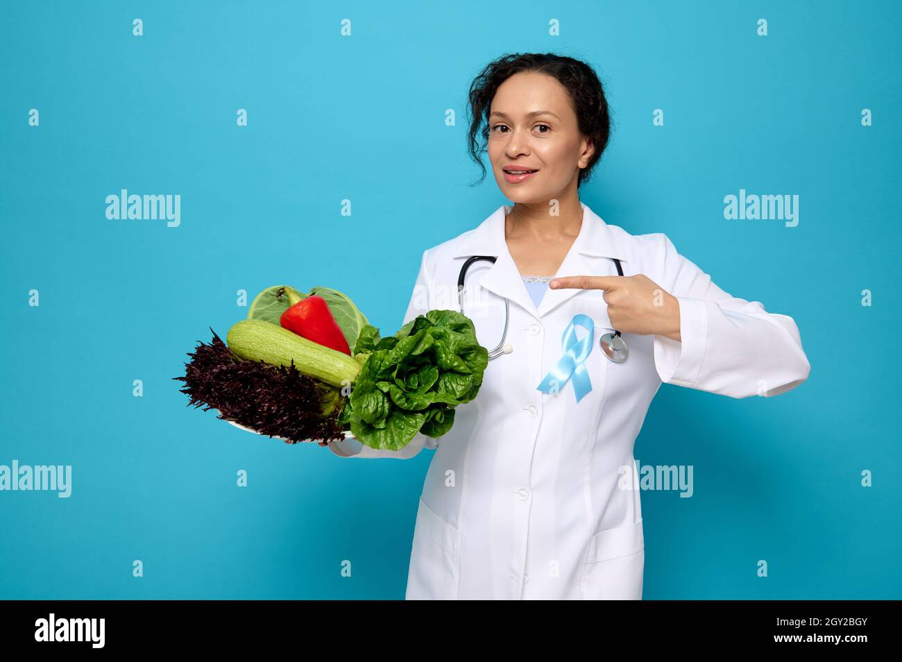 Beautiful woman, female doctor nutritionist wearing a white medical ...