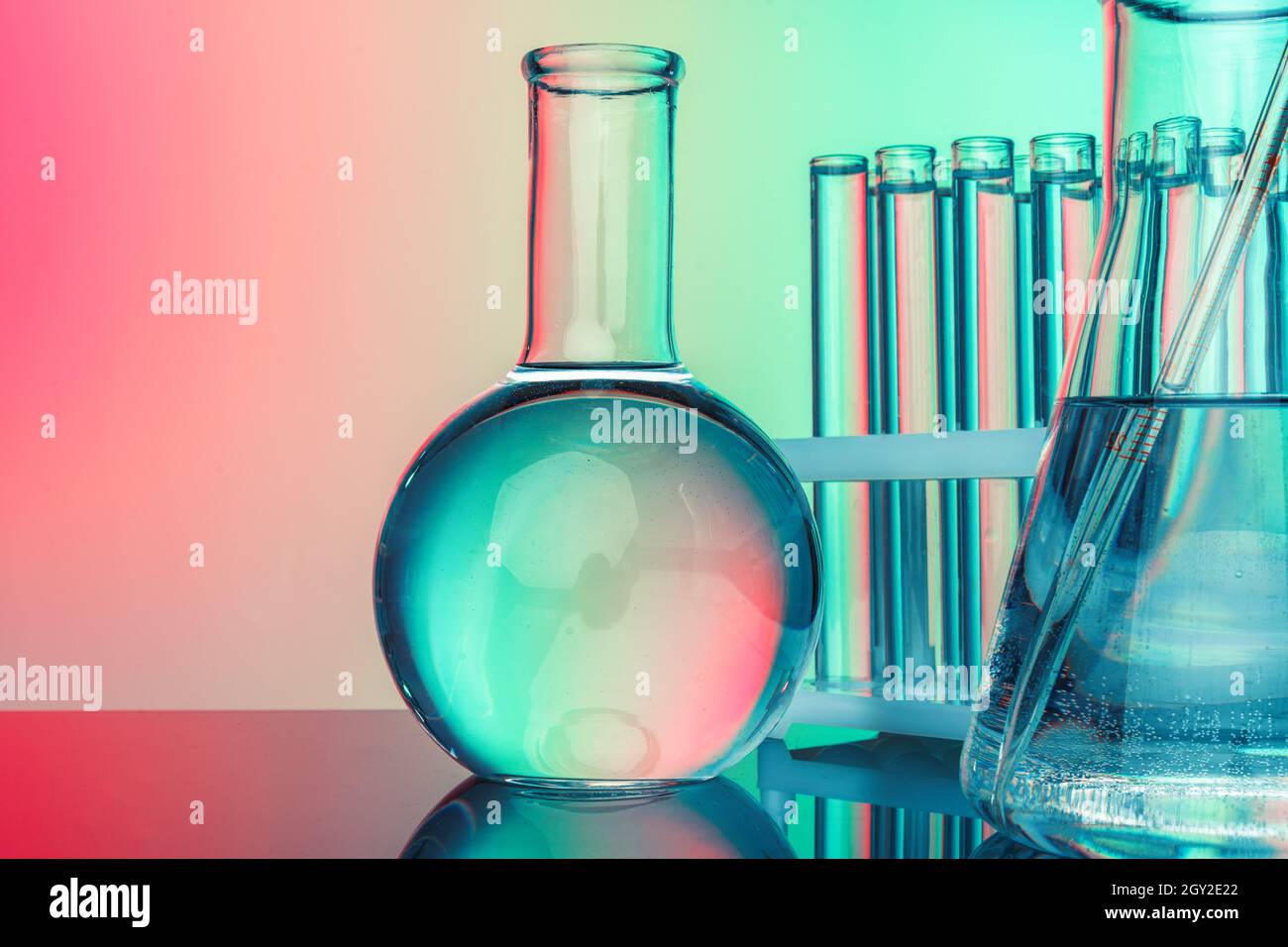 Laboratory chemistry glassware on green toned background Stock Photo ...