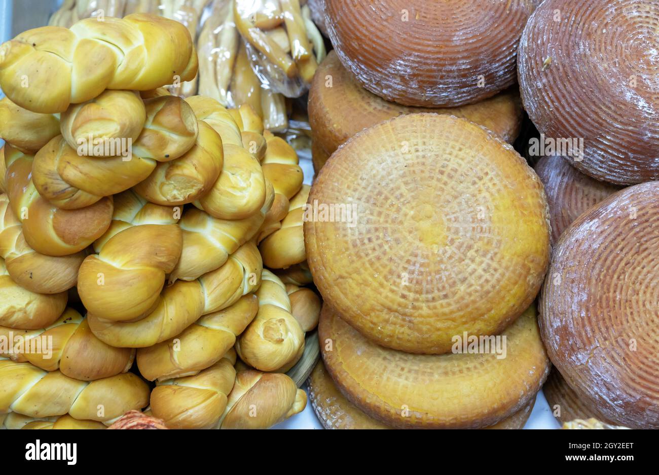 Brown and yellow round cheese and cheese cornrows on the counter ...