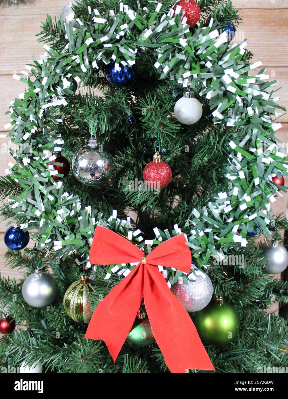 Christmas wreath on a Christmas tree Stock Photo - Alamy