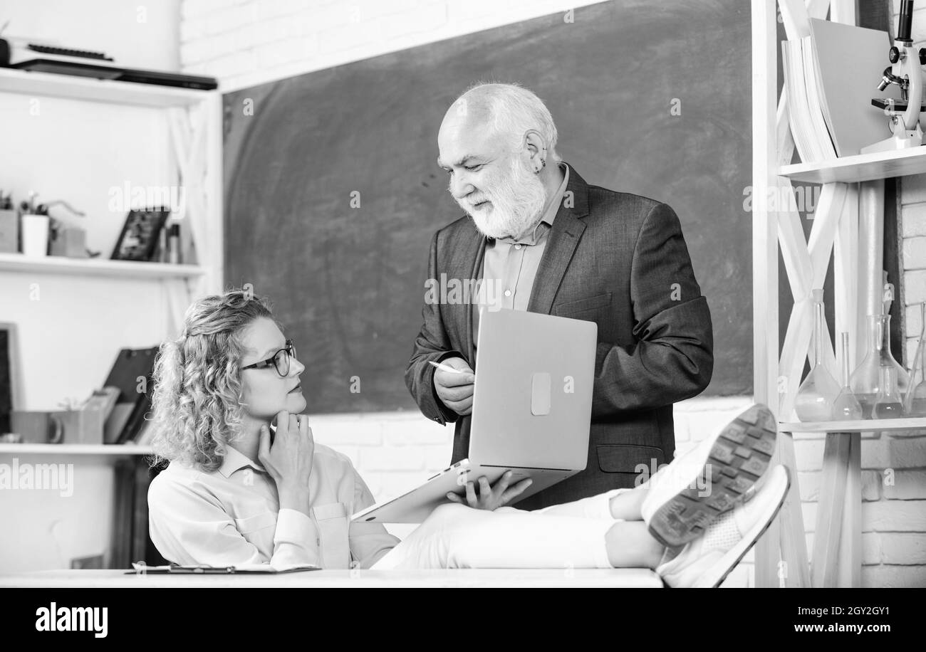 Work hard play harder. senior teacher and woman at school lesson. pass ...