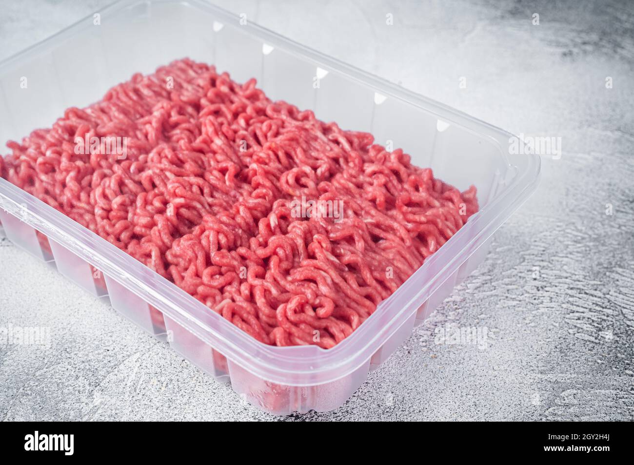 Fresh Raw mince beef and pork meat in vacuum packaging. White ...