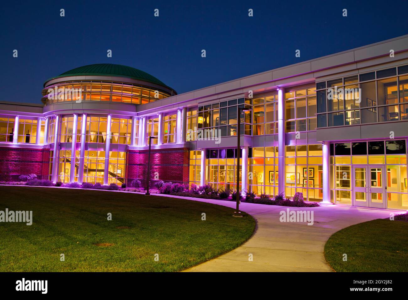 Yet another angle of the modern building with many windows at twilight ...
