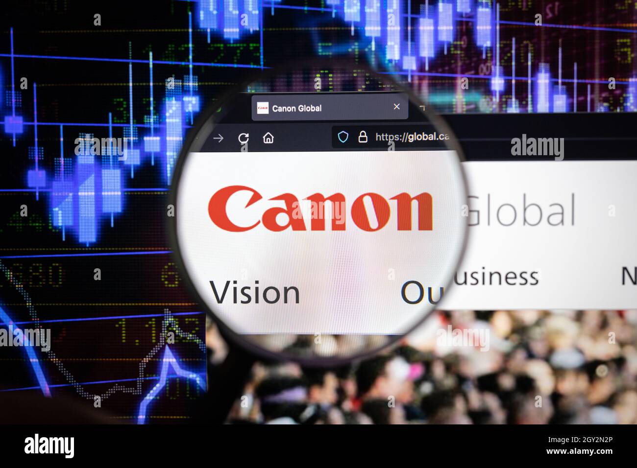 Canon company logo on a website with blurry stock market developments ...