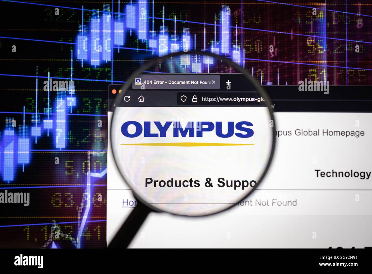Olympus company logo on a website with blurry stock market developments ...