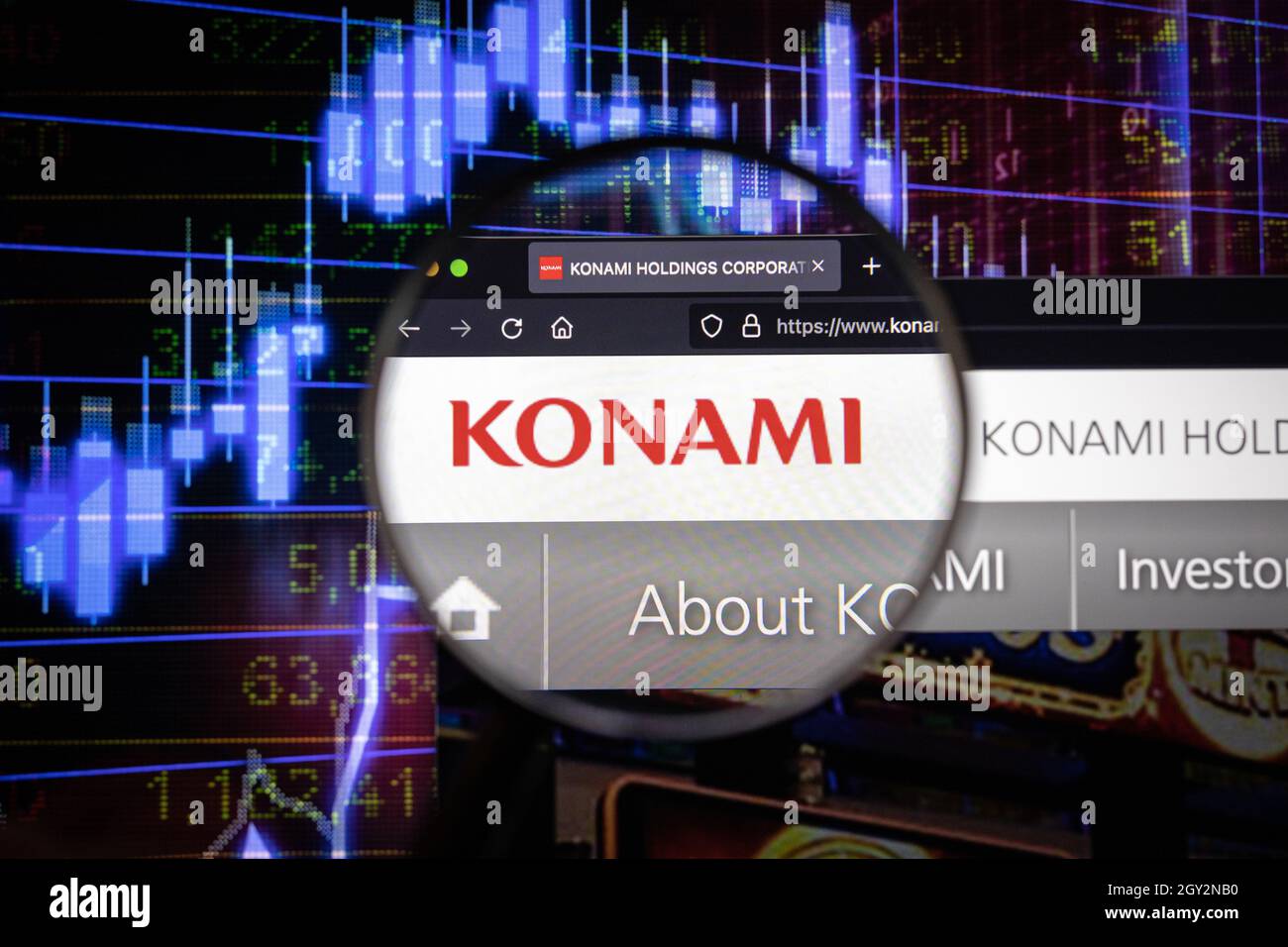 Konami company logo on a website with blurry stock market developments ...