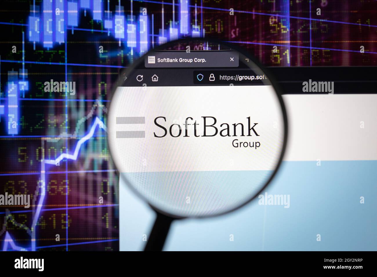 SoftBank company logo on a website with blurry stock market ...