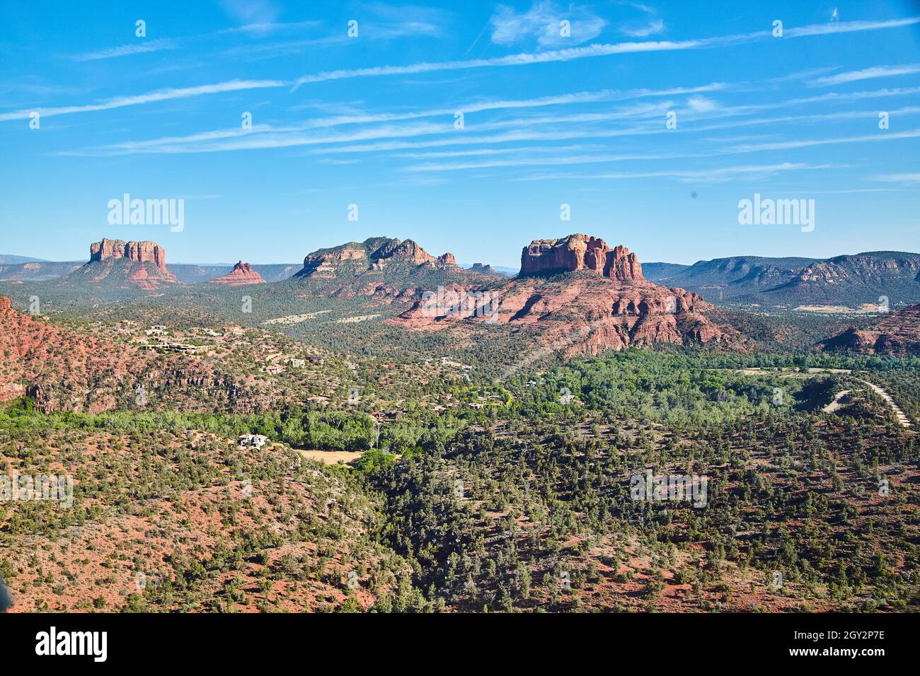 Aerial view of desert mountains red rocks and green fields Stock Photo ...