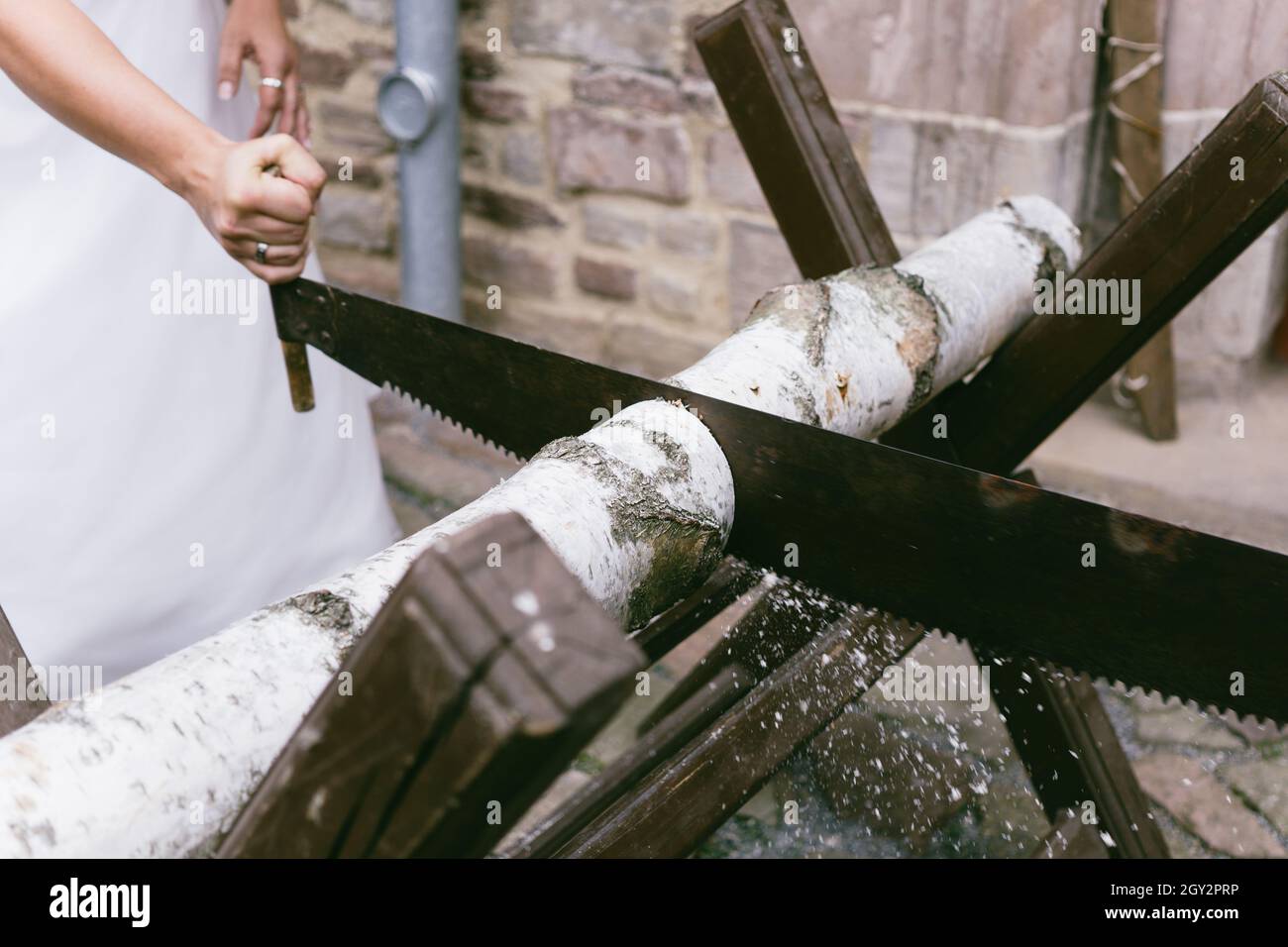 Wood column being cut Stock Photo - Alamy