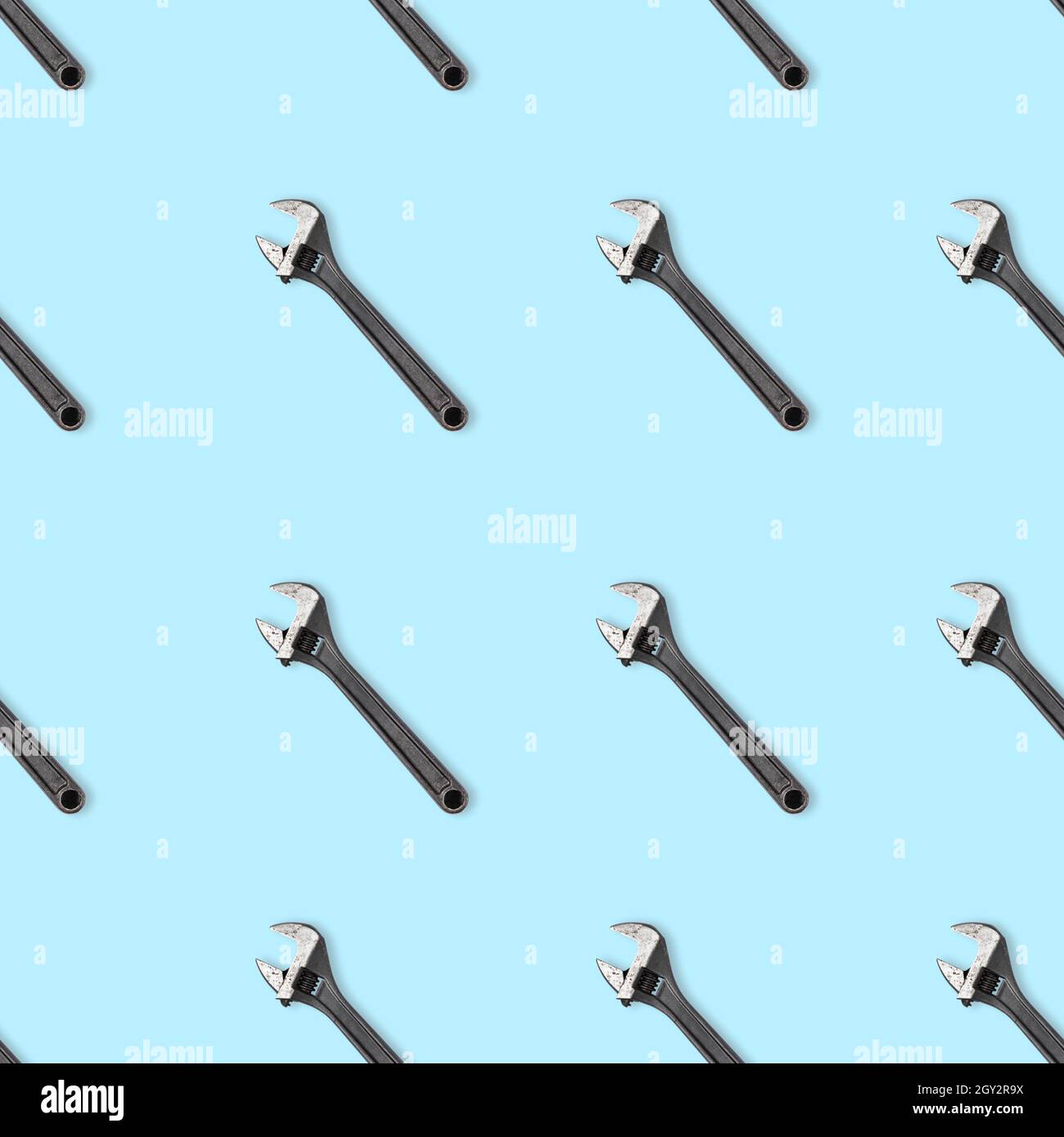 Seamless wrench pattern on light blue background. Repair service ...