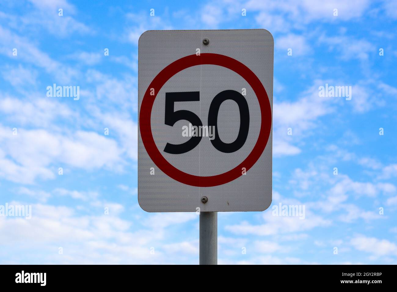 50 mph traffic sign against a cloudy sky background Stock Photo - Alamy