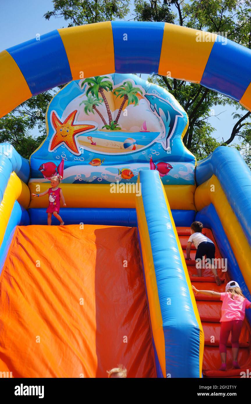 POZNAN, POLAND - May 27, 2018: A shot of children climbing and sliding ...